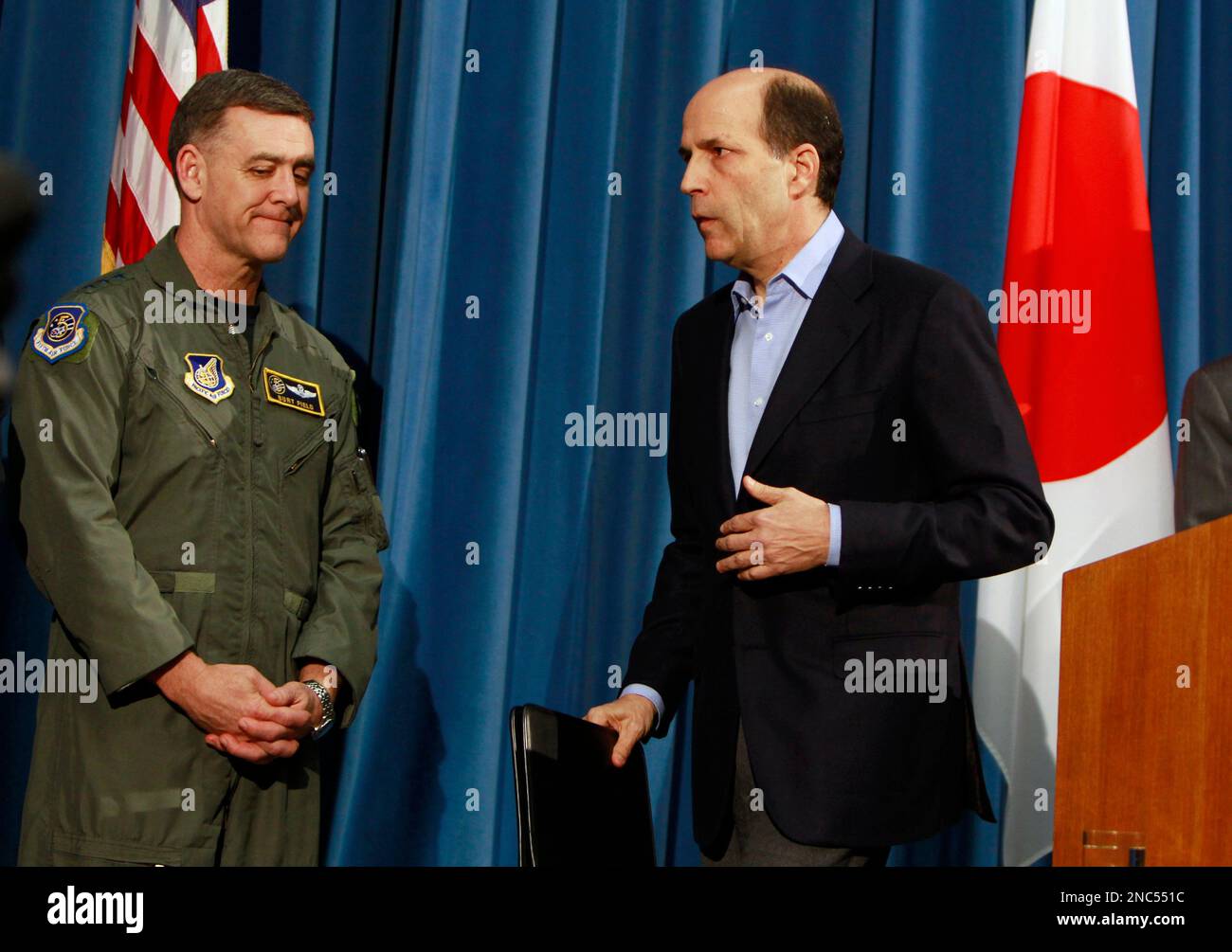 U.S. Ambassador John Roos, right, leaves the podium after addressing a ...
