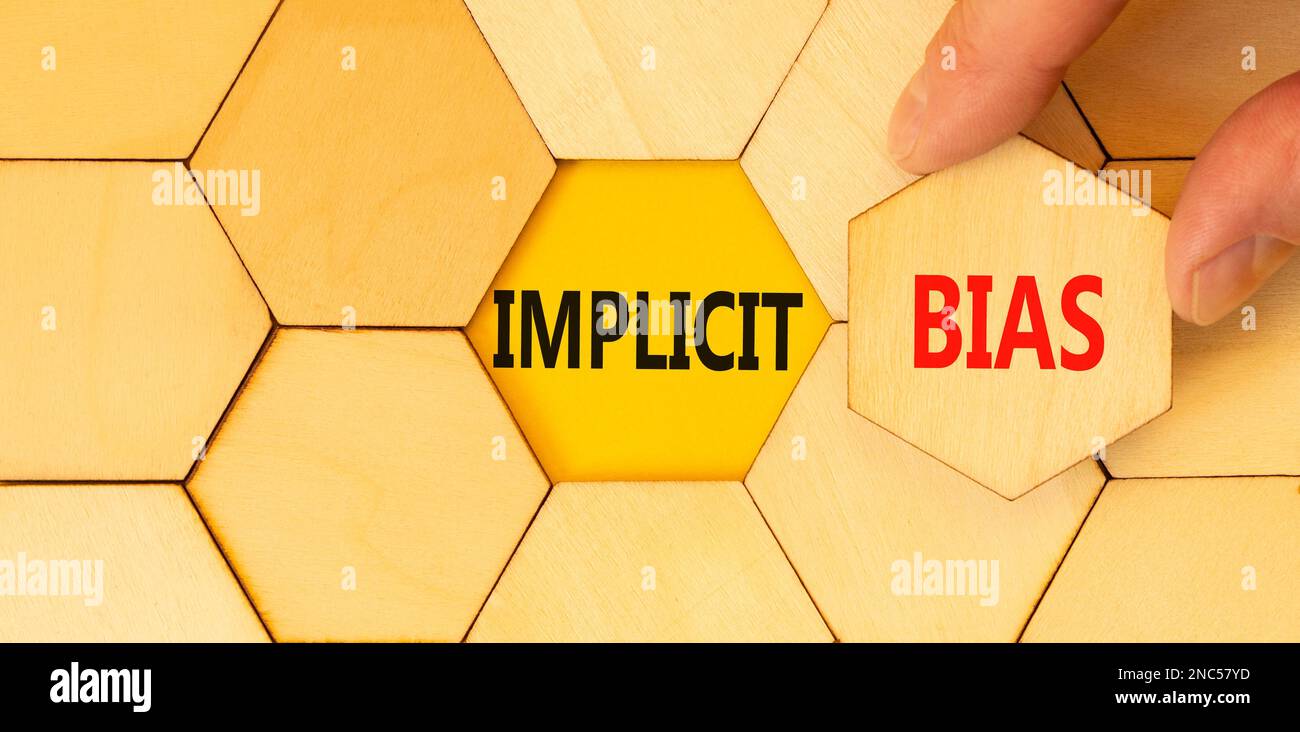 Implicit bias symbol. Concept words Implicit bias on wooden puzzles ...