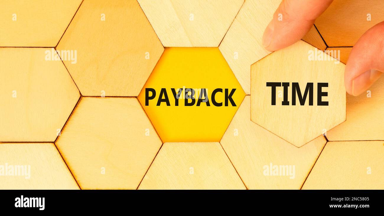 Payback time symbol. Concept words Payback time on wooden puzzles ...
