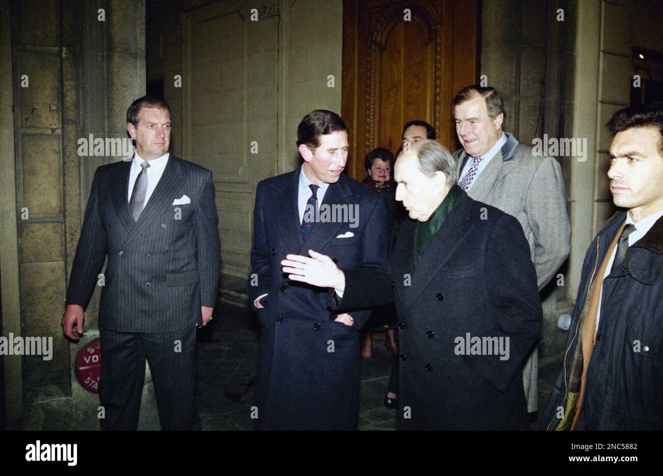 Britainâ€™s Prince Charles, left, strolls back to his embassy with ...