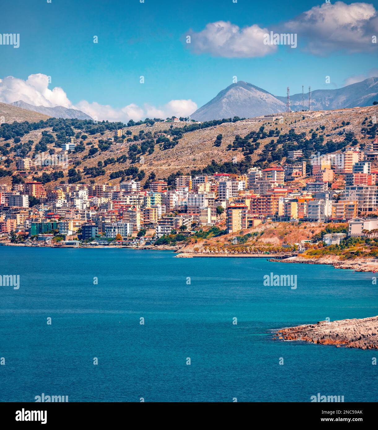 Bright summer cityscape of Saranda port. Attractive Ioninan seascape ...