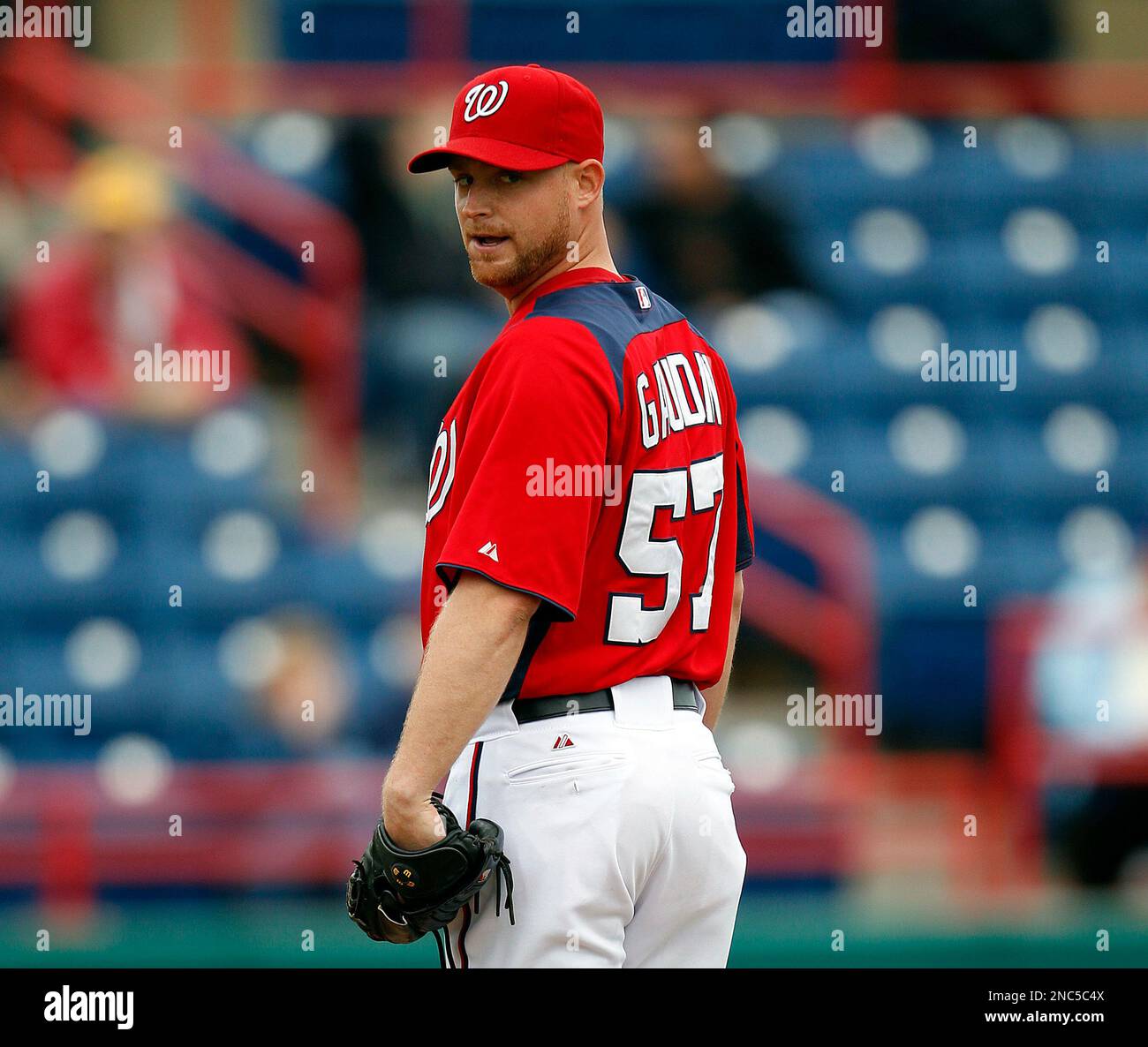 Washington Nationals pitcher Chad Gaudin looks back to first base ...