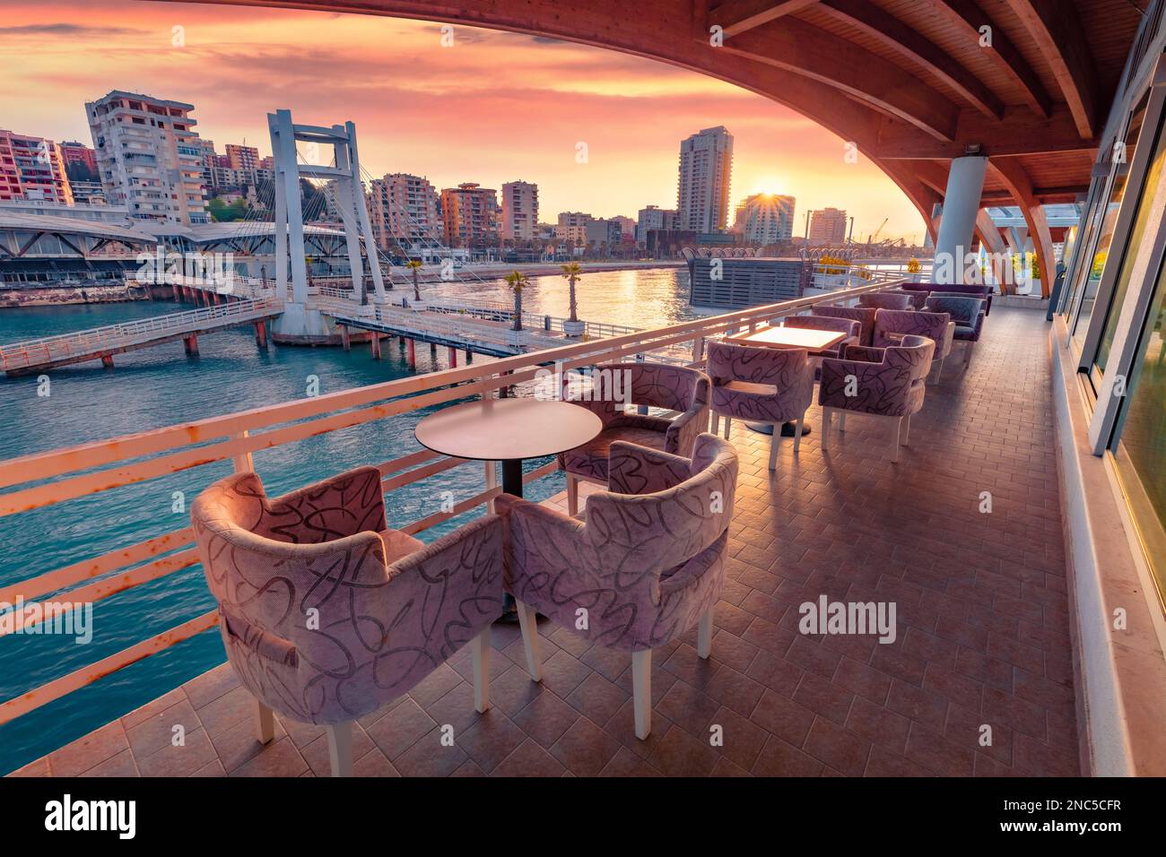 Empty outdoor cafe. Astonishing sunrise in Durres, port city on the ...