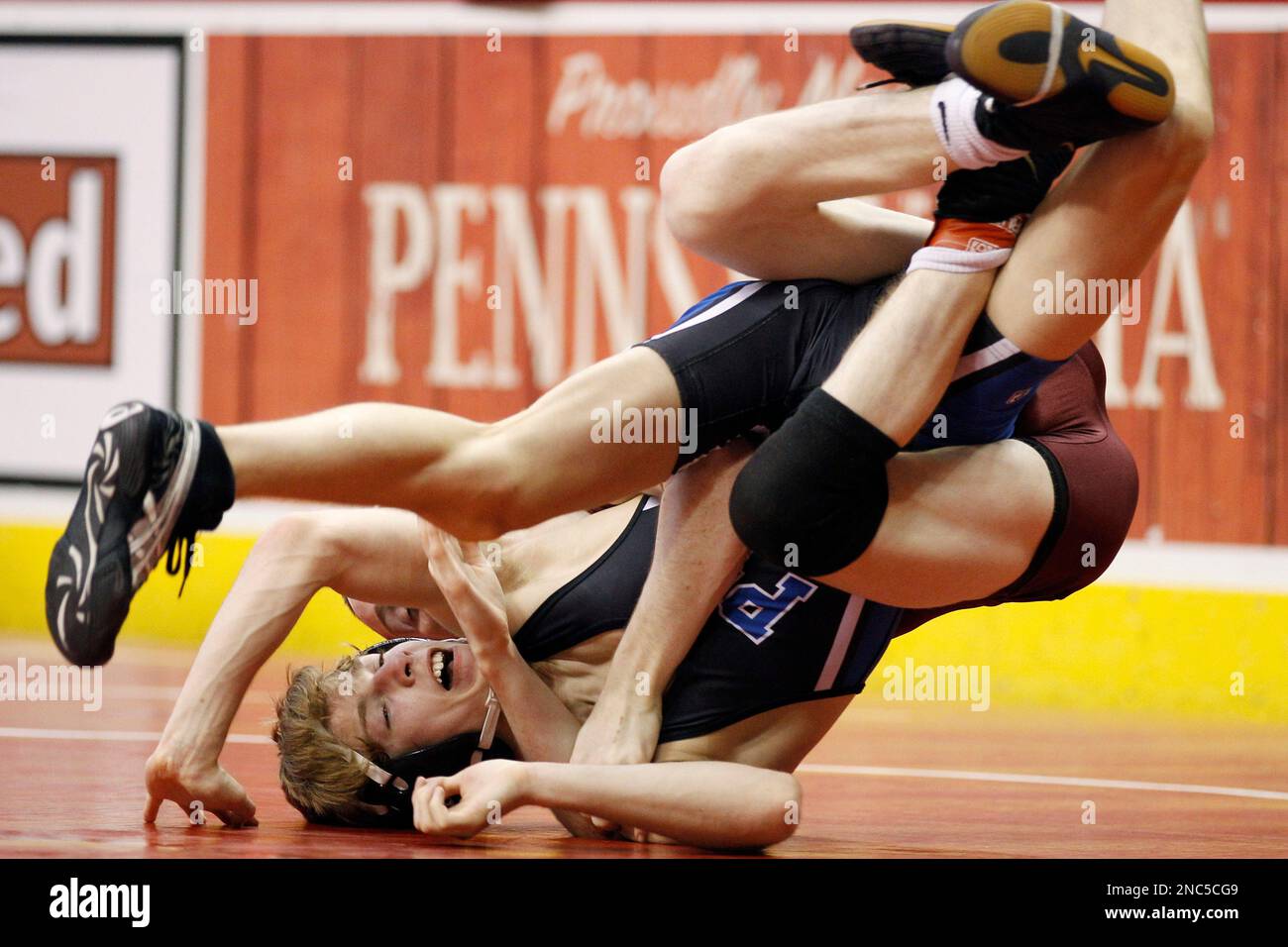 Kenny Yanovich, bottom, of Pleasant Valley High School struggles with ...