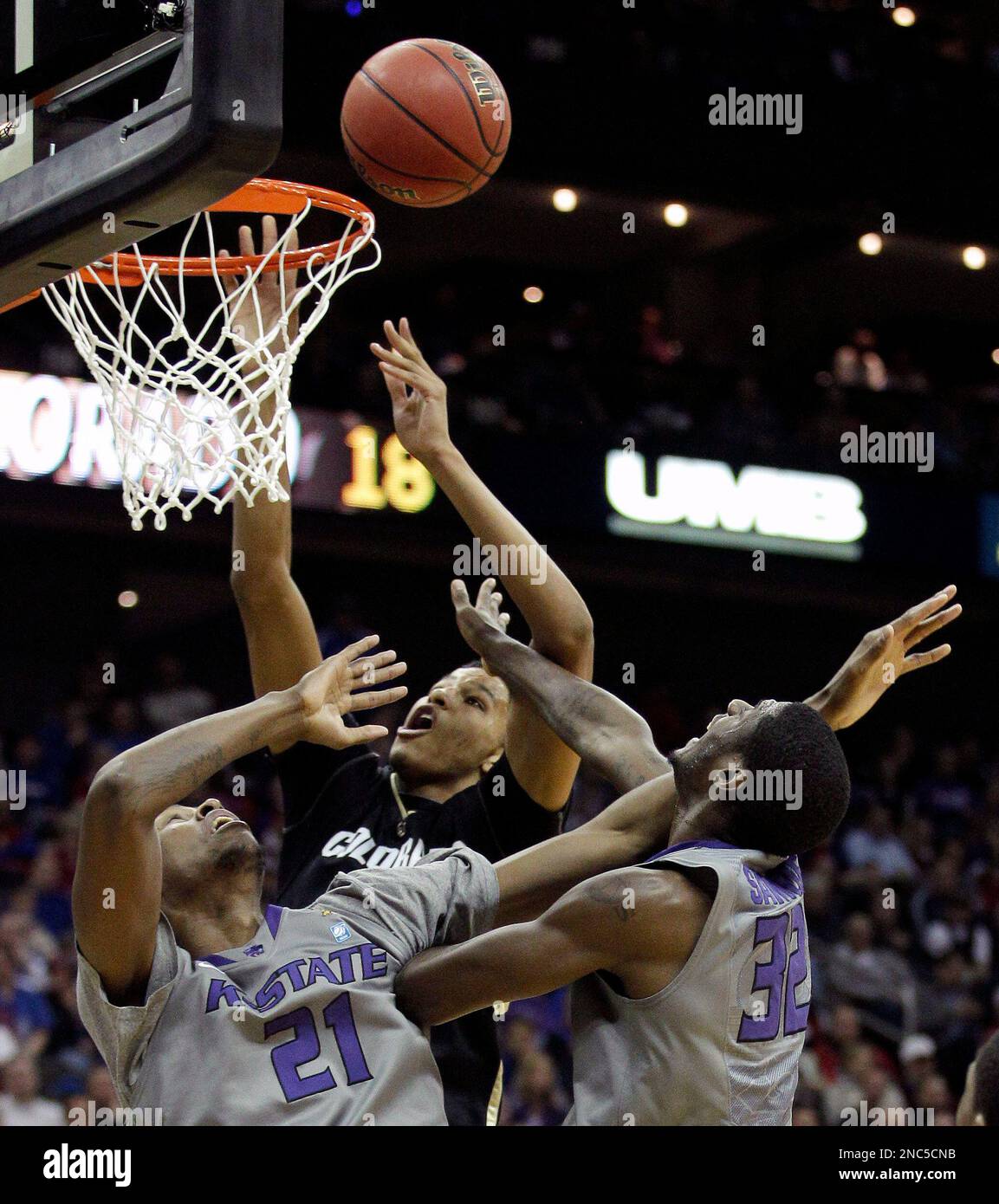 Colorado guard Andre Roberson, center, puts up a shot under pressure ...