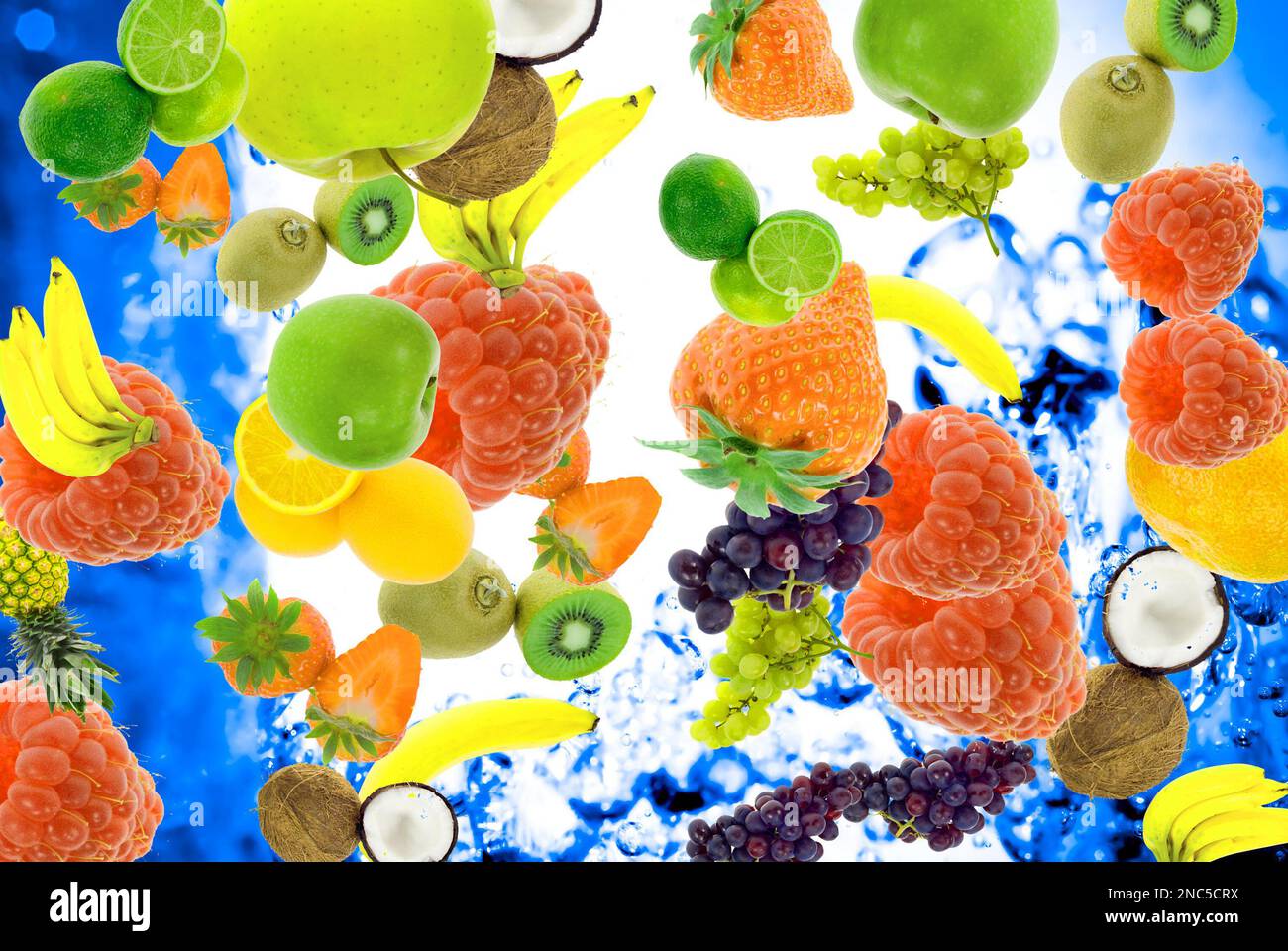 Colorful summer fruits against a blue background Stock Photo - Alamy