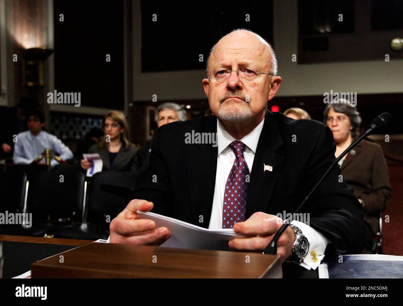 James R. Clapper, Jr., Director of National Intelligence, prepares to ...
