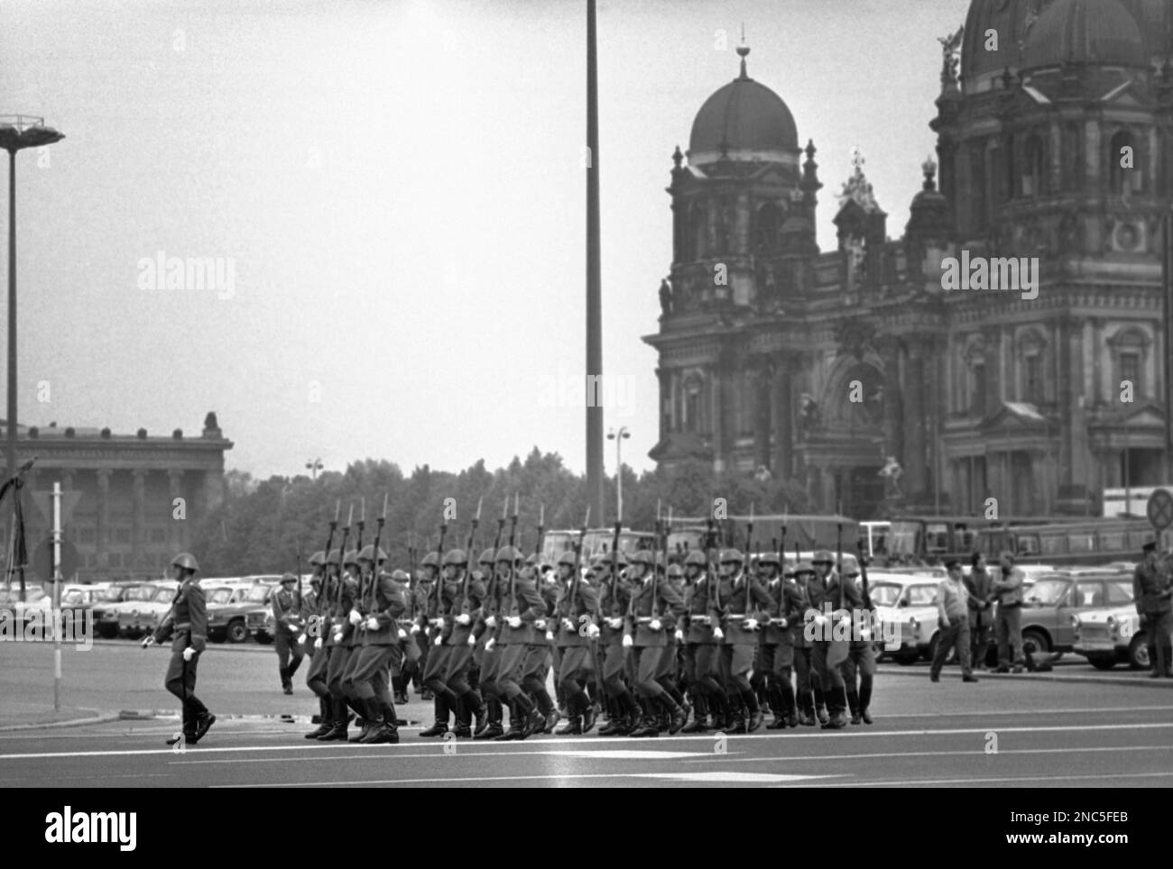 East German honor guard parade in front of the monumental cathedral ...