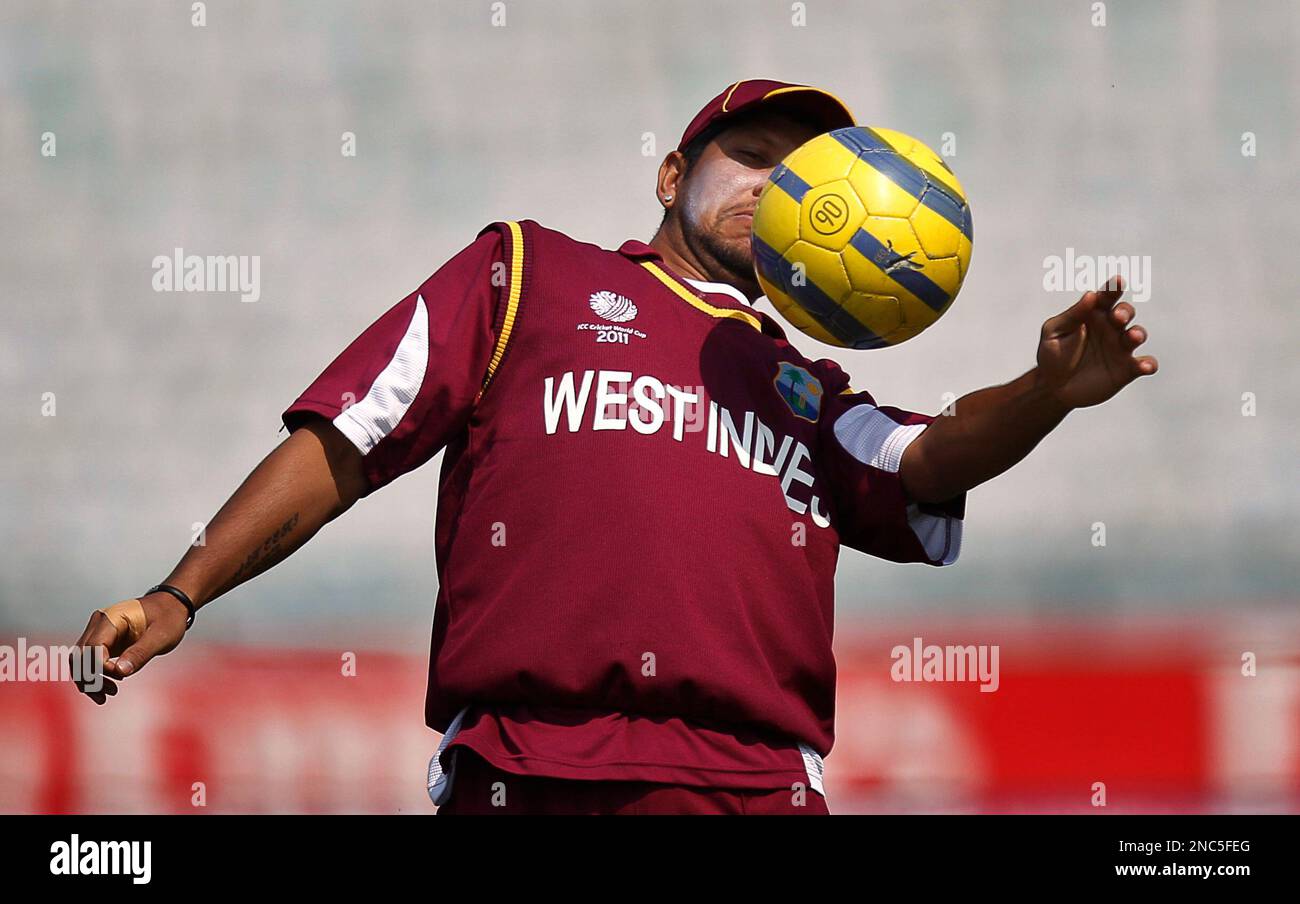 West Indies' cricketer Ramnaresh Sarwan controls a soccer ball during a ...