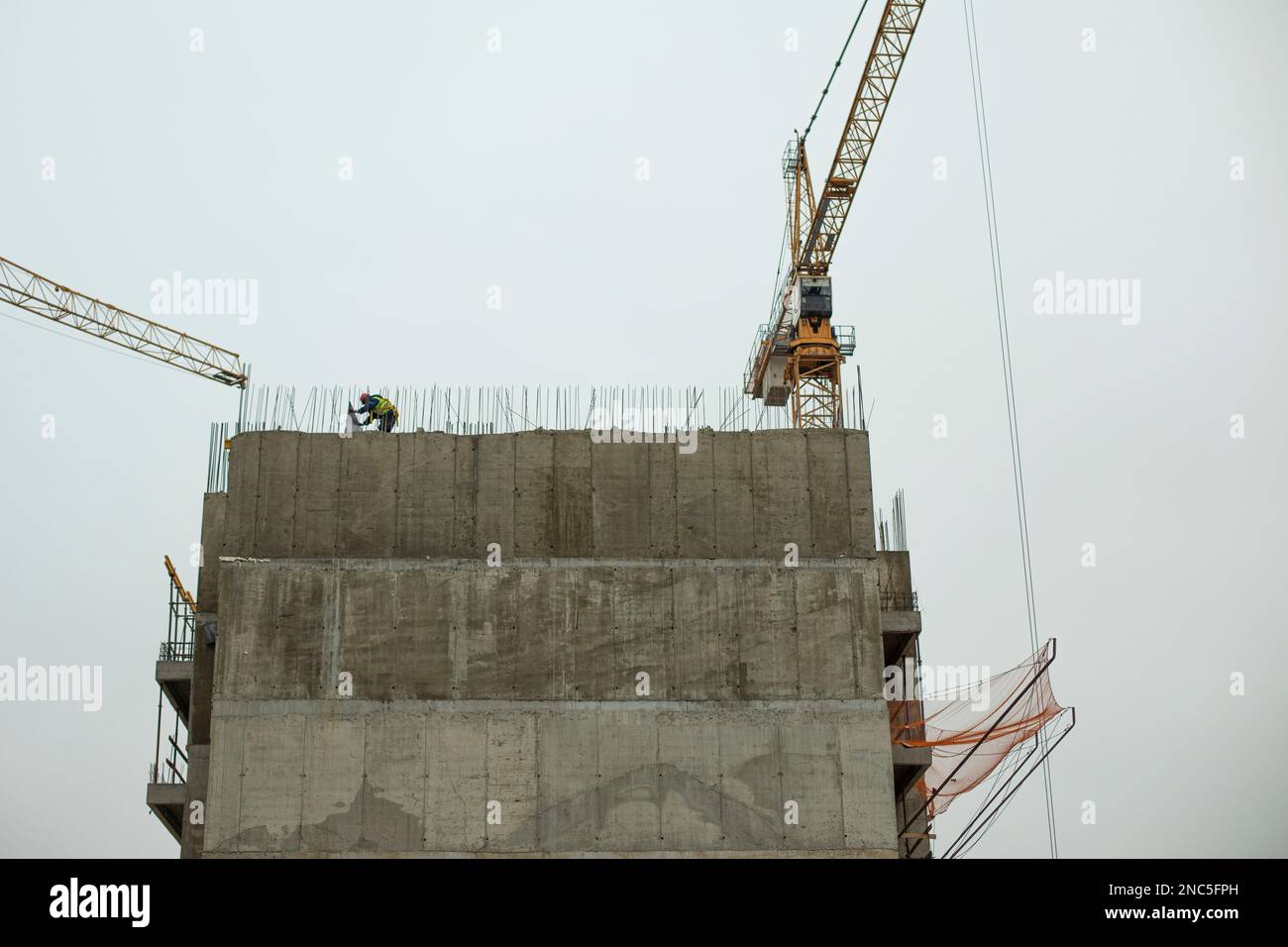Building house. New building. Concrete frame. Construction of high-rise ...