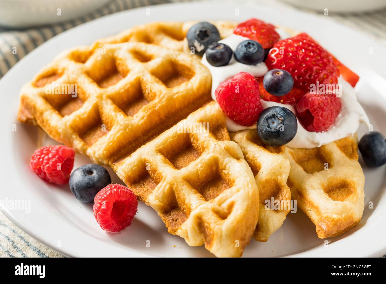 Homemade Croissant Waffle Croffles with Berries and Cream Stock Photo ...