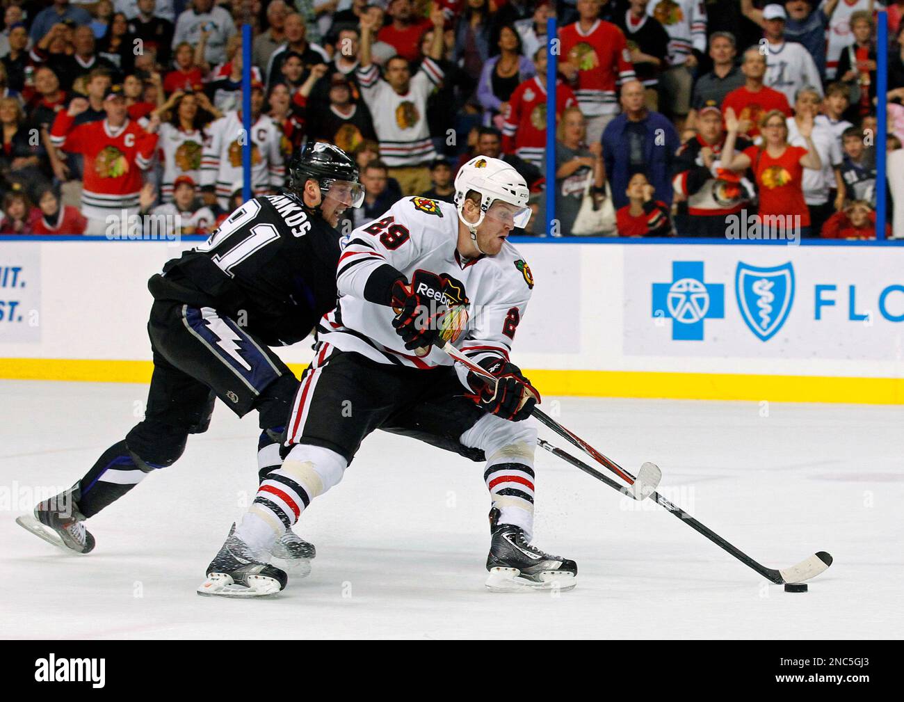 Tampa Bay Lightning's Steven Stamkos, left, defends a breakaway by ...