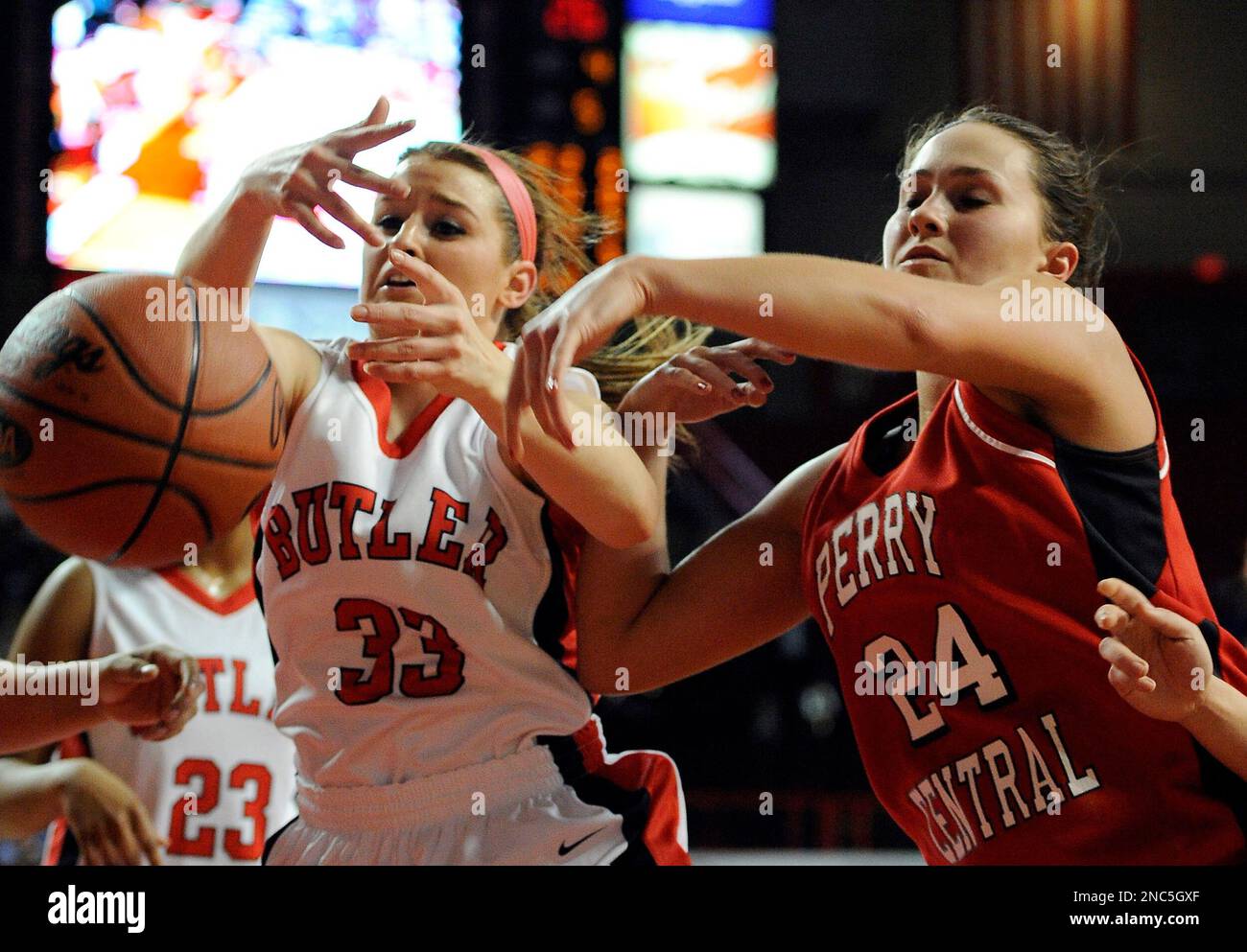 Butler's Megan Cureton (33) and Perry Central's Alyssa Pratt (24) grab ...