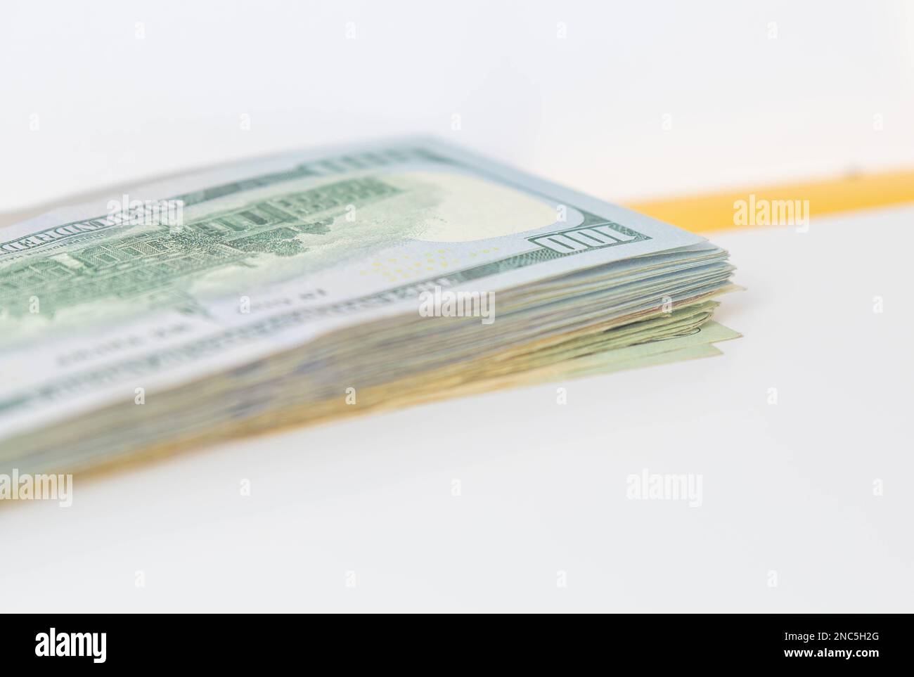 A pack of hundred dollar bills isolated on the white background Stock ...