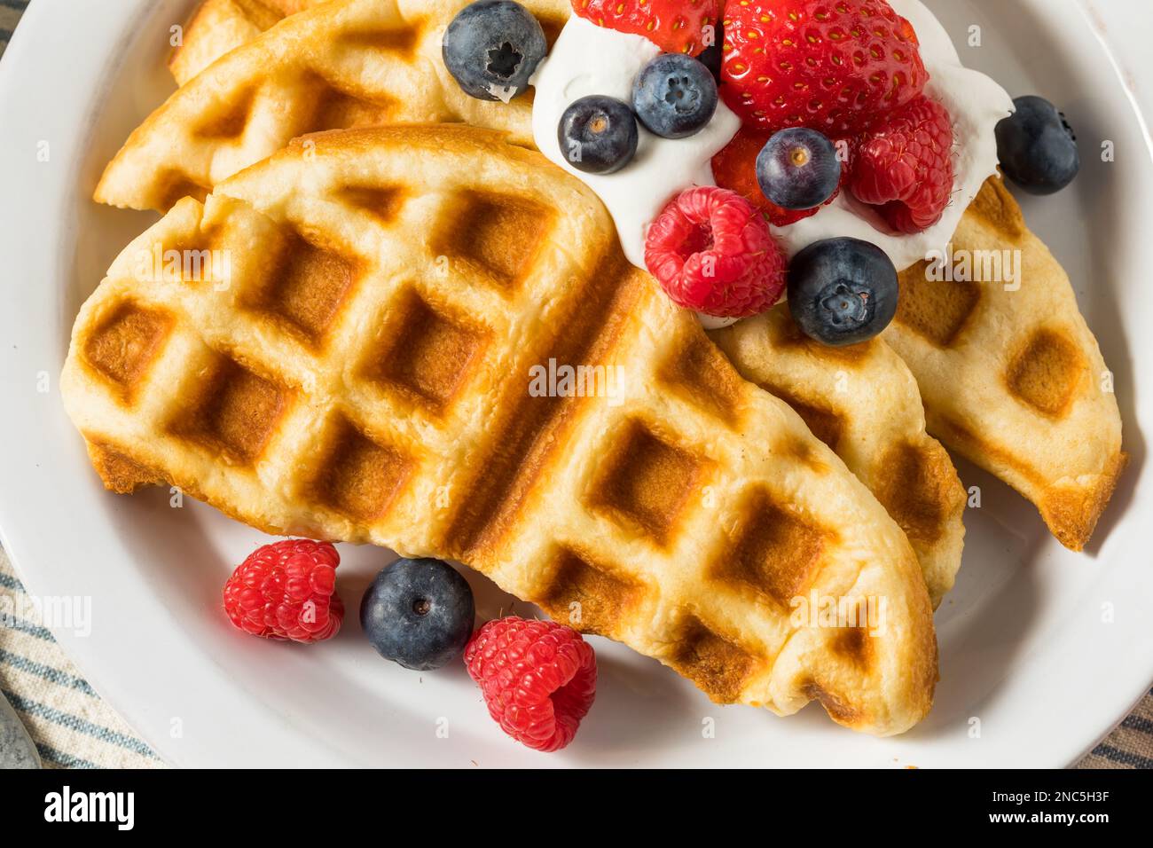 Homemade Croissant Waffle Croffles with Berries and Cream Stock Photo ...