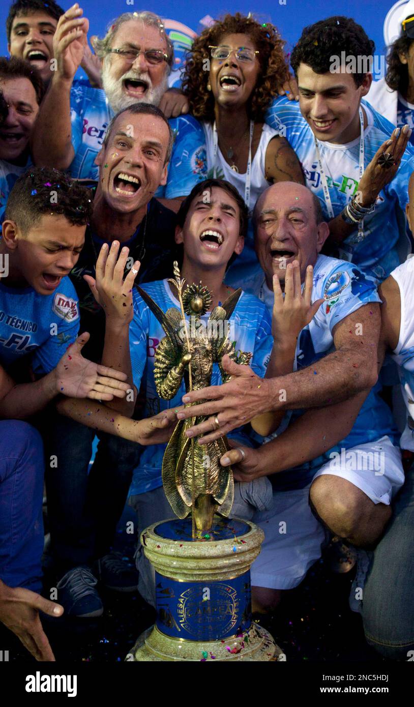 Members of the Beija-Flor samba school celebrate with their trophy ...