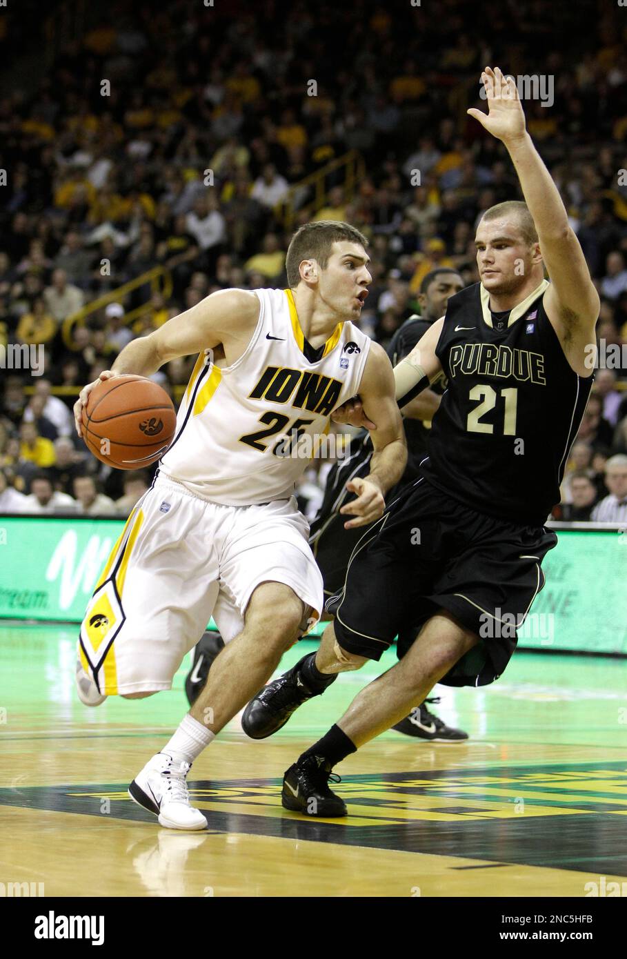 Iowa guard Eric May, left, drives past Purdue guard D.J. Byrd during ...