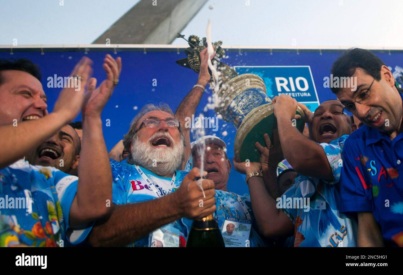 Members of the Beija-Flor samba school celebrate with their trophy ...