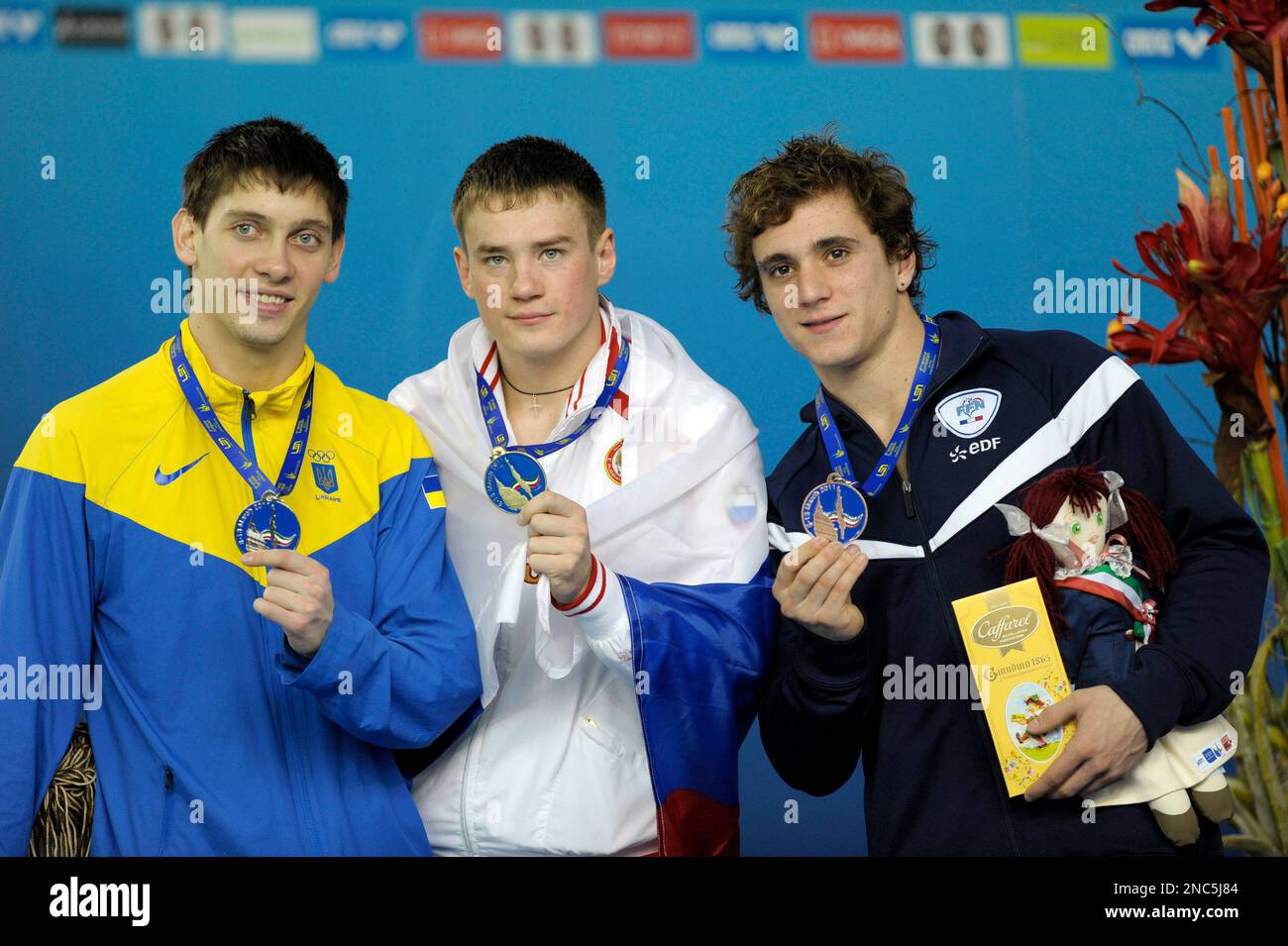 Russian gold medal Evgeny Kuznetsov, center, celebrates during the ...