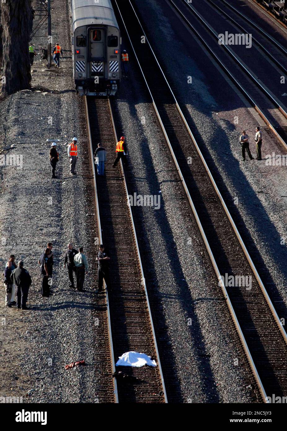 The covered body of a pedestrian that was struck and killed by an ...