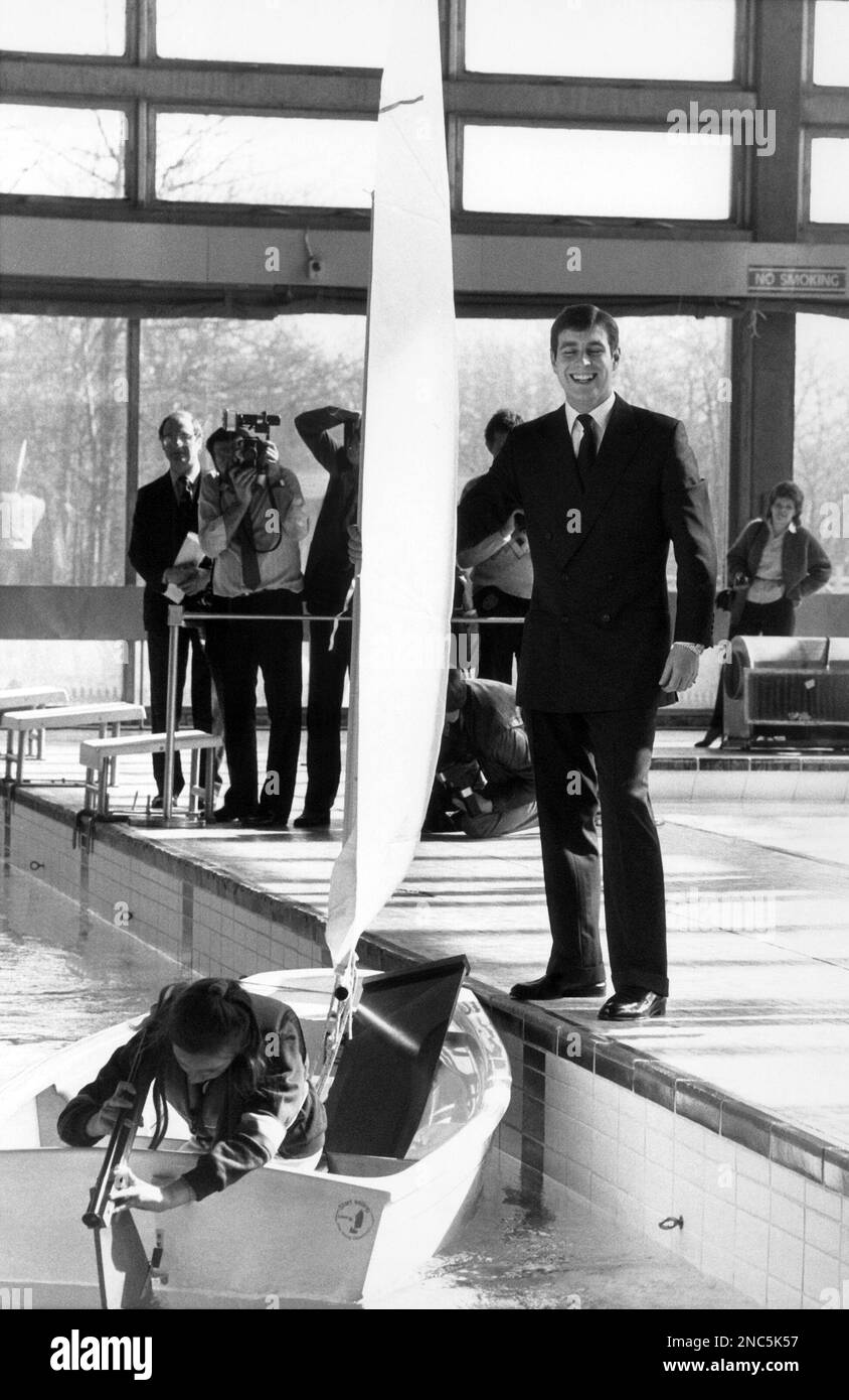 Prince Andrew holds a dinghy steady for 11-year-old Tracey Sutton, of ...