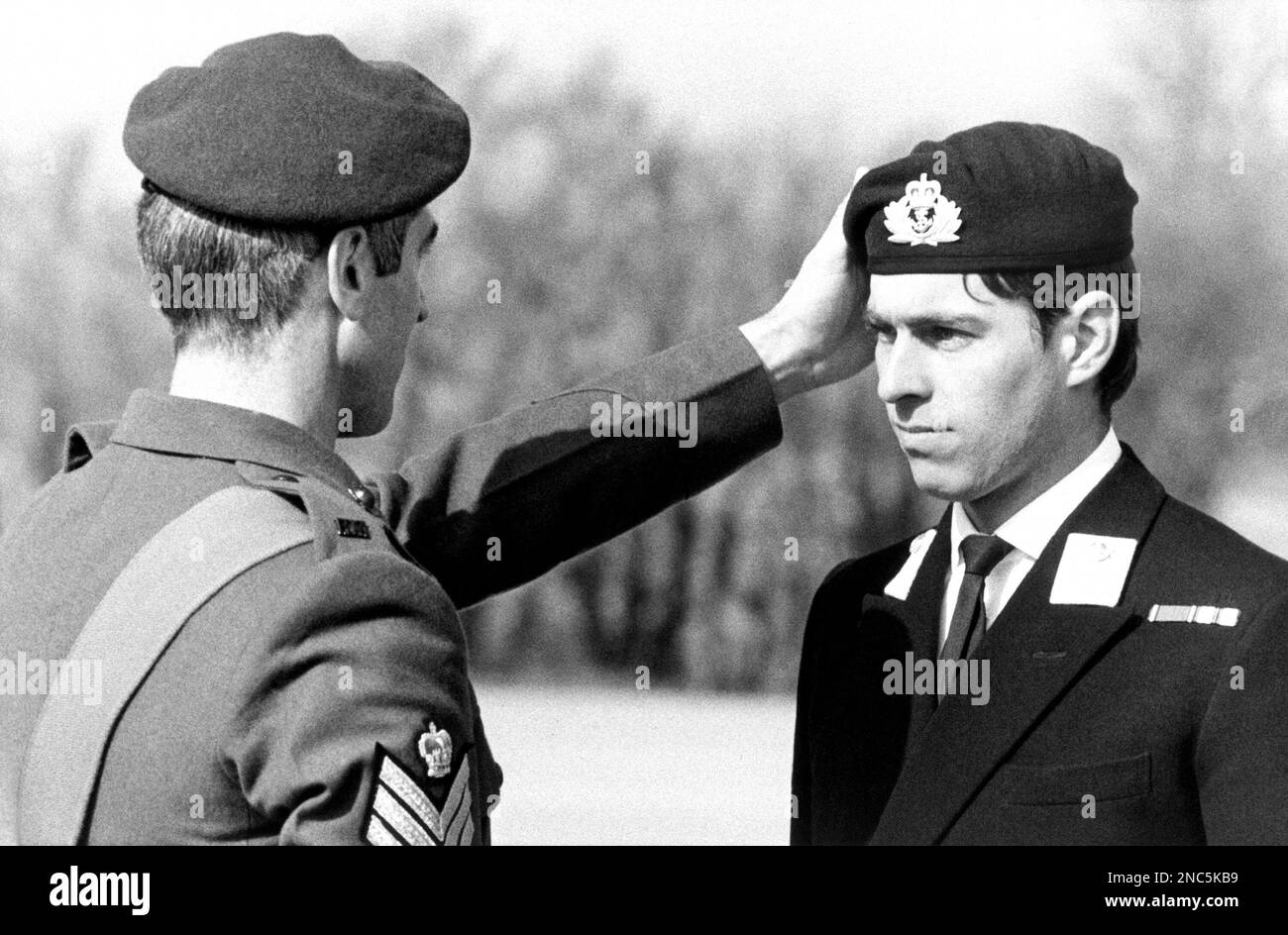 Drill Sergeant Dennis Mortimer adjusts the coveted Green Beret award ...