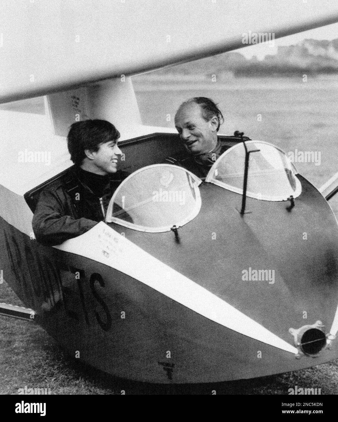 Britain’s Prince Andrew, left, chats with his instructor, flight ...