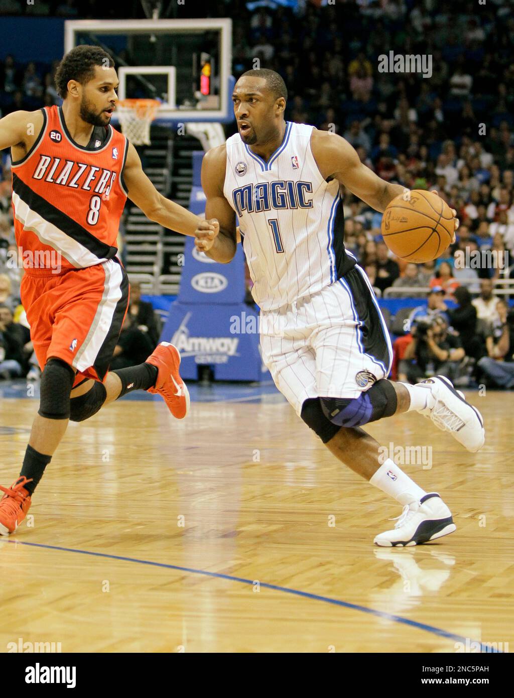 Orlando Magic's Gilbert Arenas (1) drives around Portland Trail Blazers ...