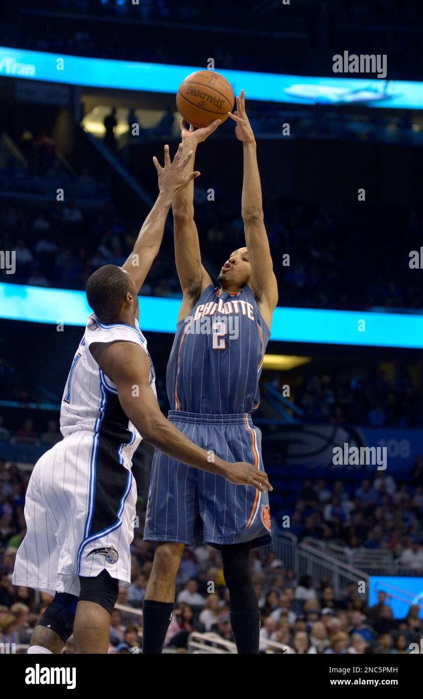 Charlotte Bobcats guard Shaun Livingston, right, puts up a shot in ...