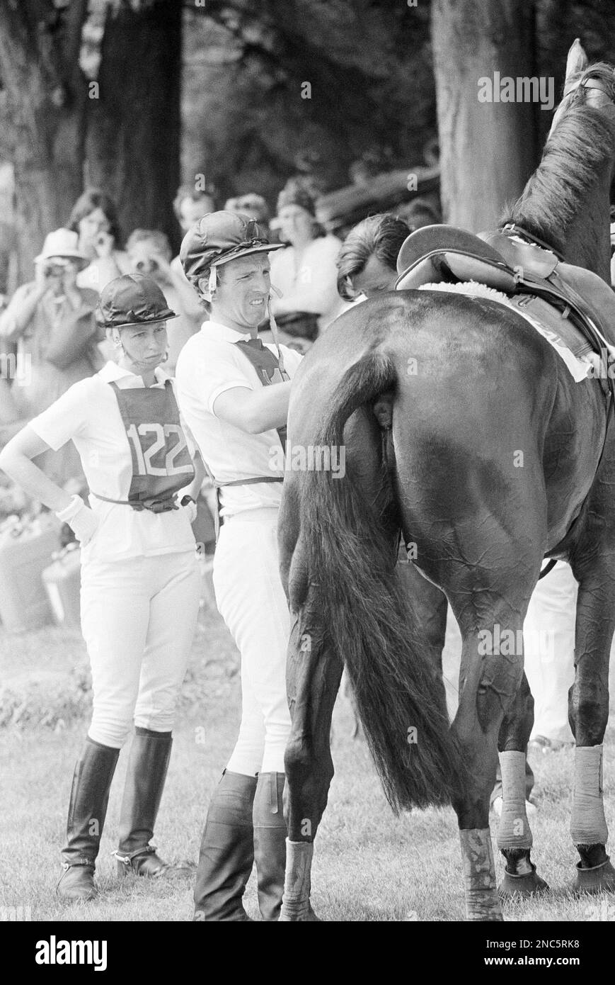 Capt. Mark Phillips adjusts the saddle for his wife Princess Anne at U ...
