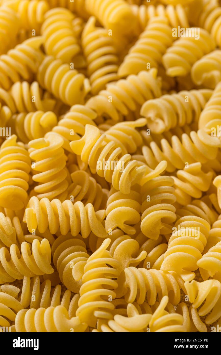 Raw Dry Organic Fusilli Pasta in a Bowl Stock Photo - Alamy