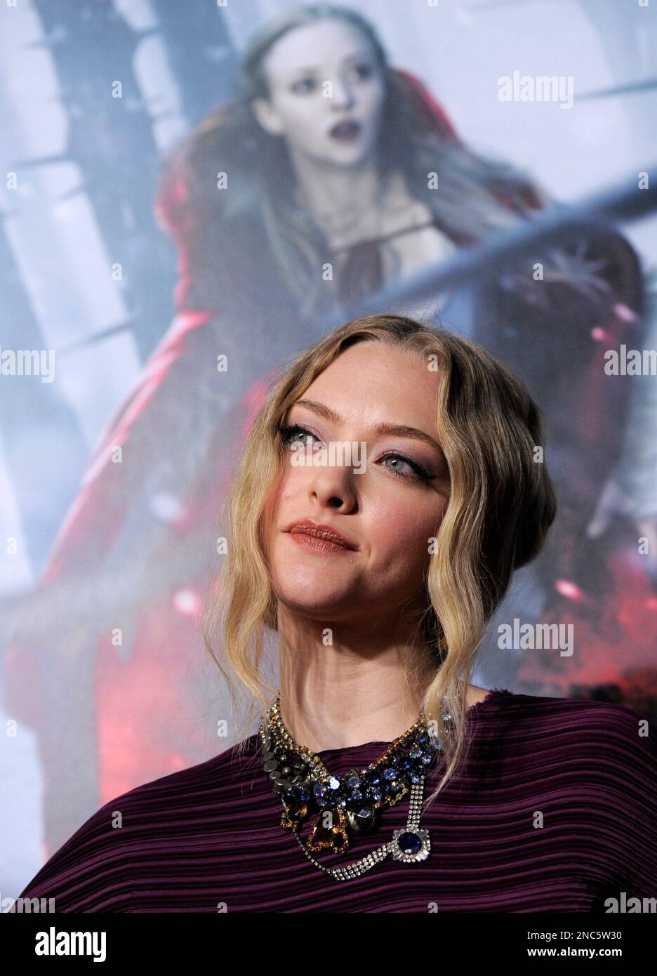 Amanda Seyfried, star of "Red Riding Hood," poses at the premiere of ...