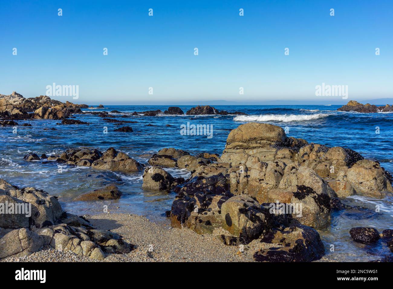 Rock formations on a beach in Monterey Bay with a ocean view Stock ...