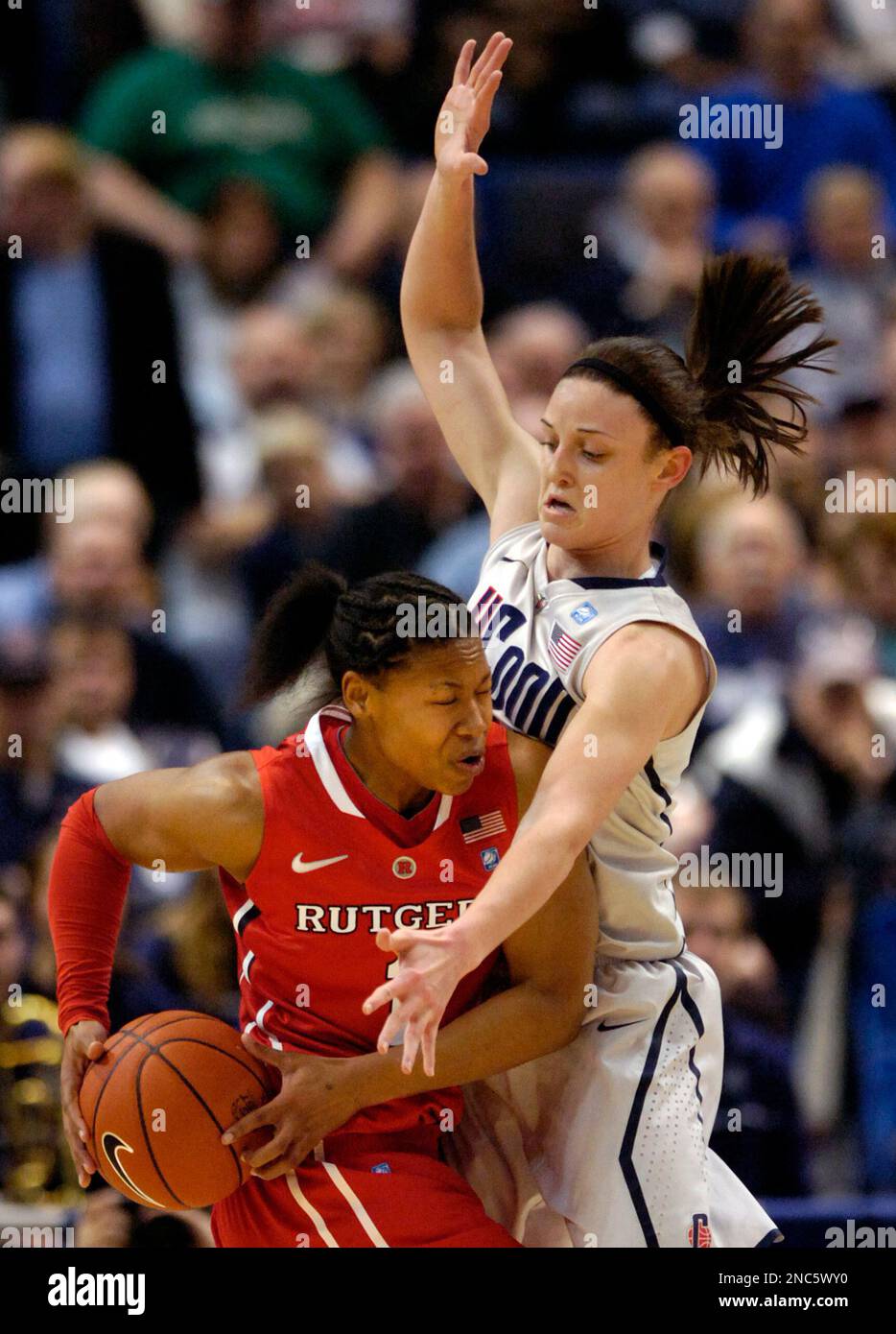 Connecticut's Kelly Faris, right, guards Rutgers' Khadijah Rushdan ...