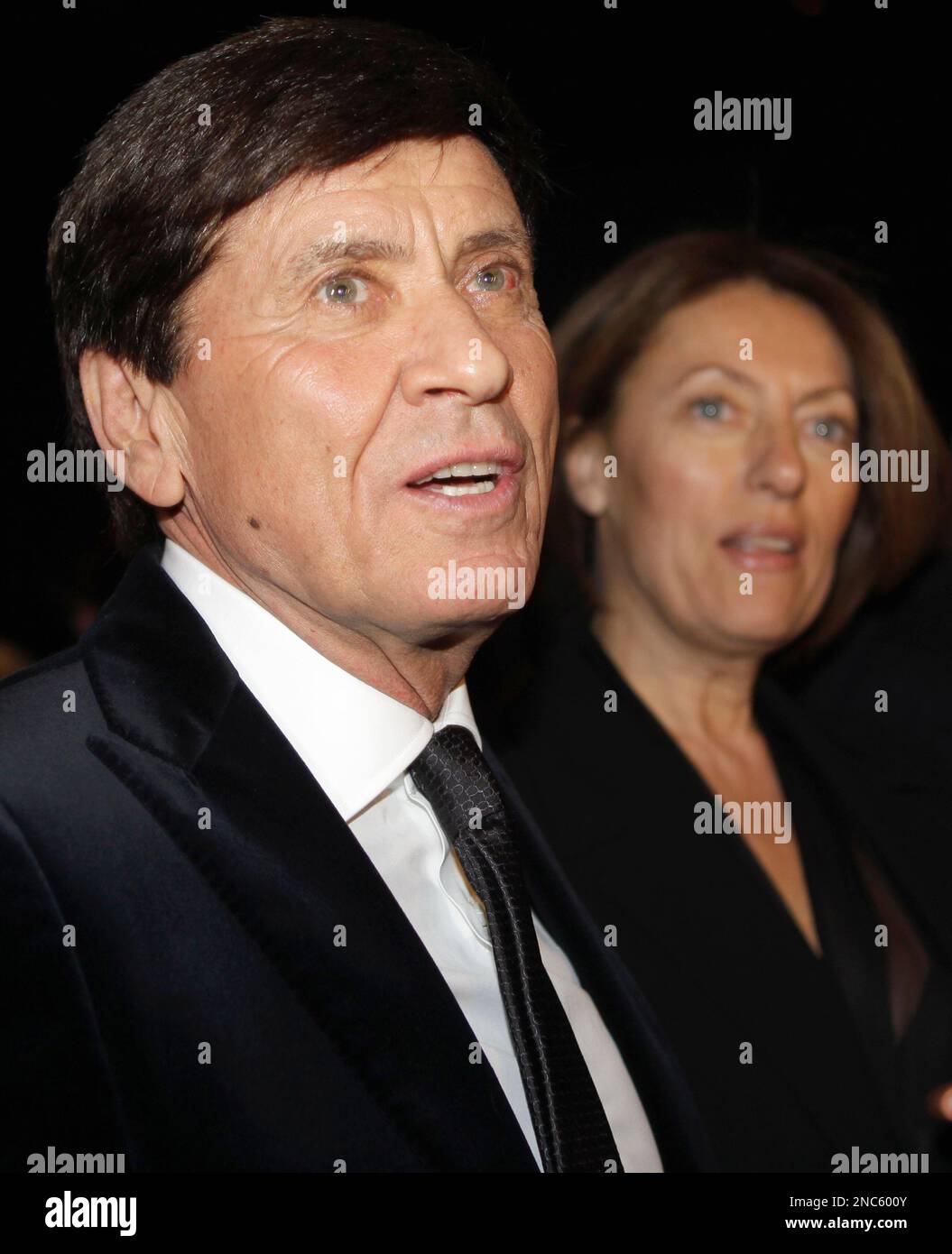 Italian singer Gianni Morandi and his wife Anna Dan are seen in this ...