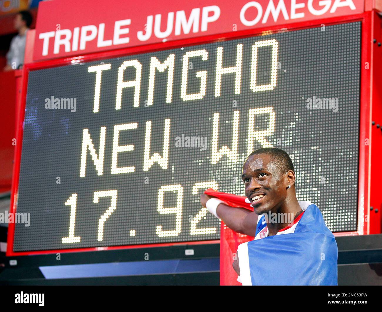Teddy Tamgho of France reacts in front of the scoreboard after winning ...
