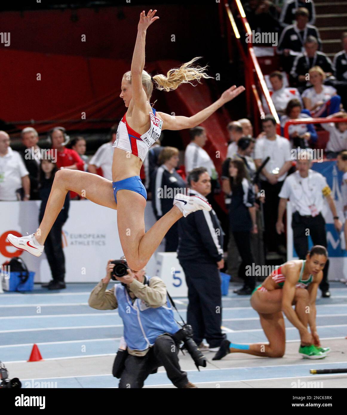 Portugal's Naide Gomes, right, watches as Russia's Darya Klishina ...
