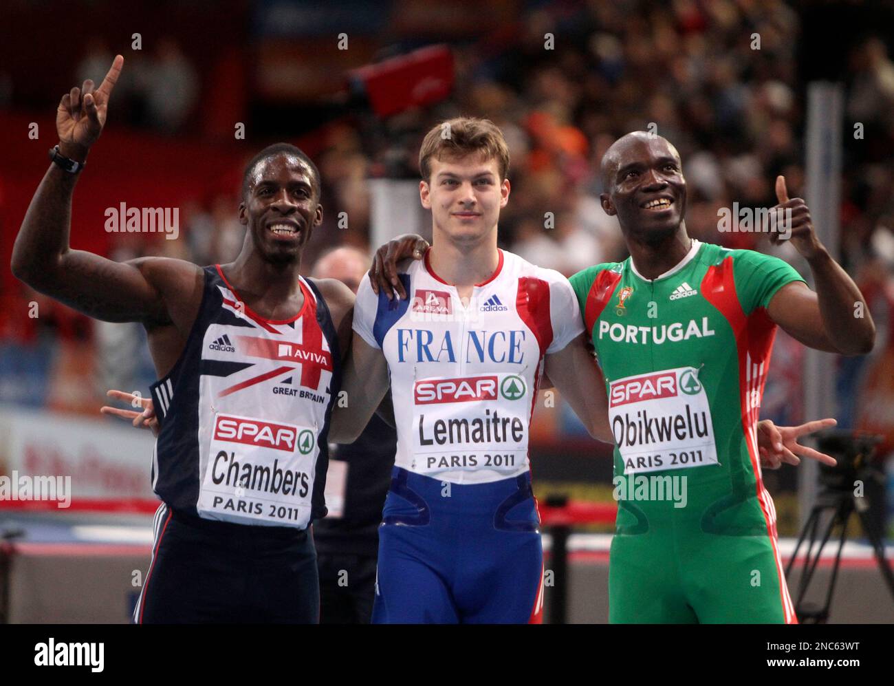 Portugal's Francis Obikwelu, right, gold medalist in the 60m men's ...