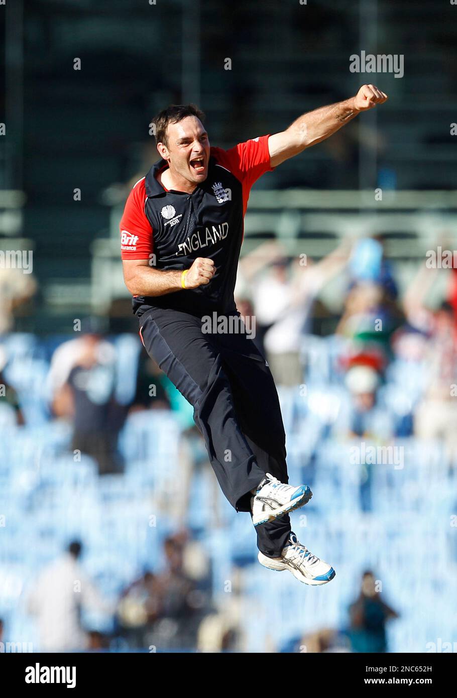 England's cricketer Michael Yardy jumps to celebrate the dismissal of ...