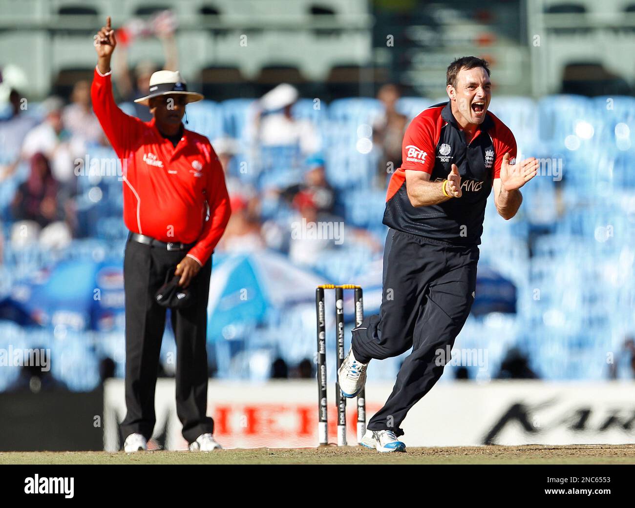 England's cricketer Michael Yardy, right, celebrates the dismissal of ...