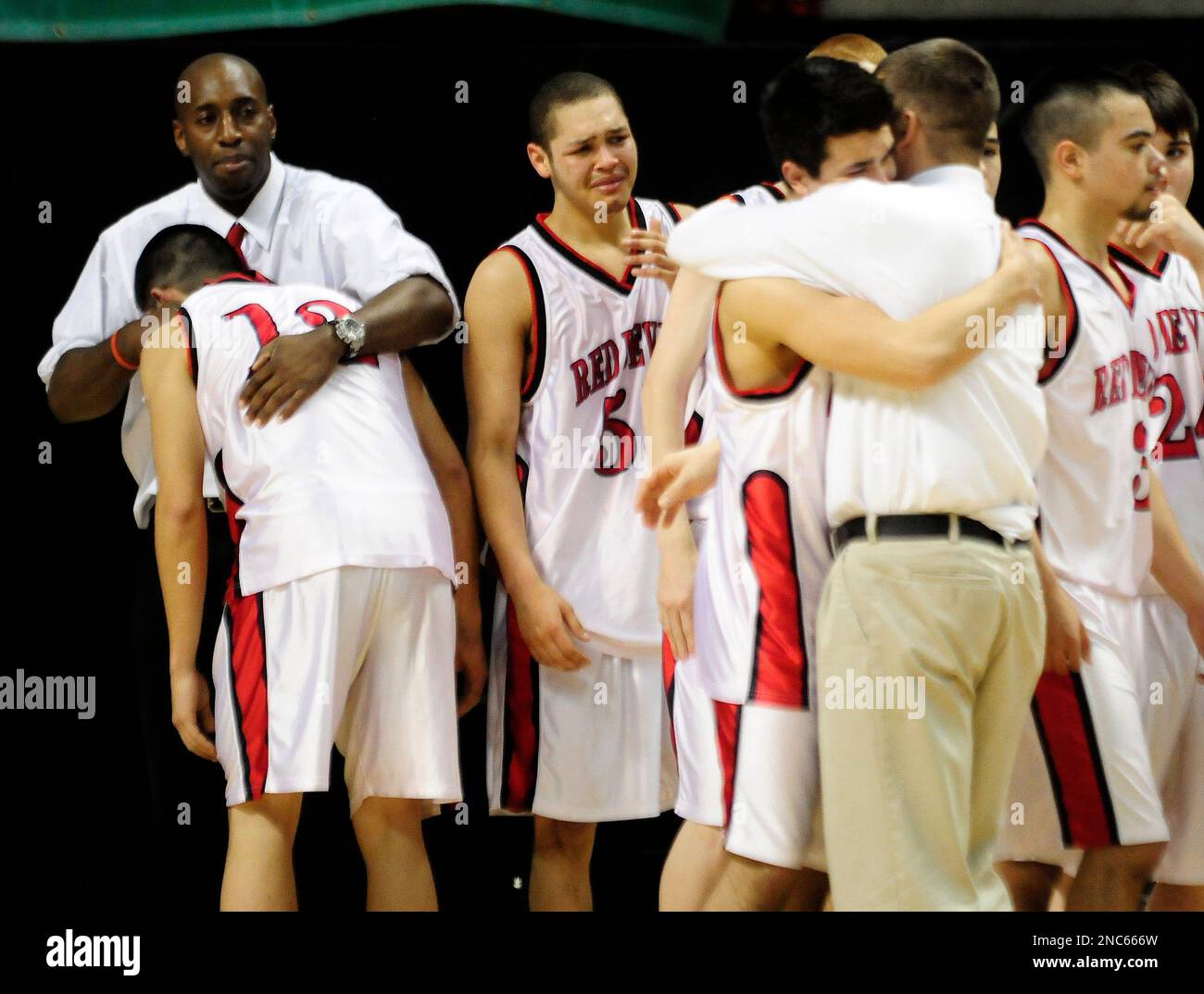 Neah Bay players react Saturday, March 5, 2011, after they lost the ...