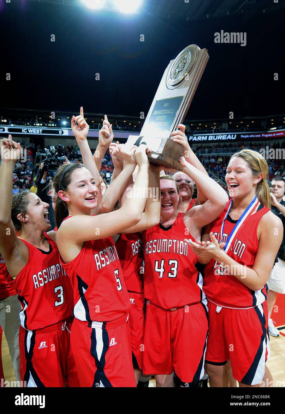 Davenport Assumption players hoist the trophy after defeating Mount ...