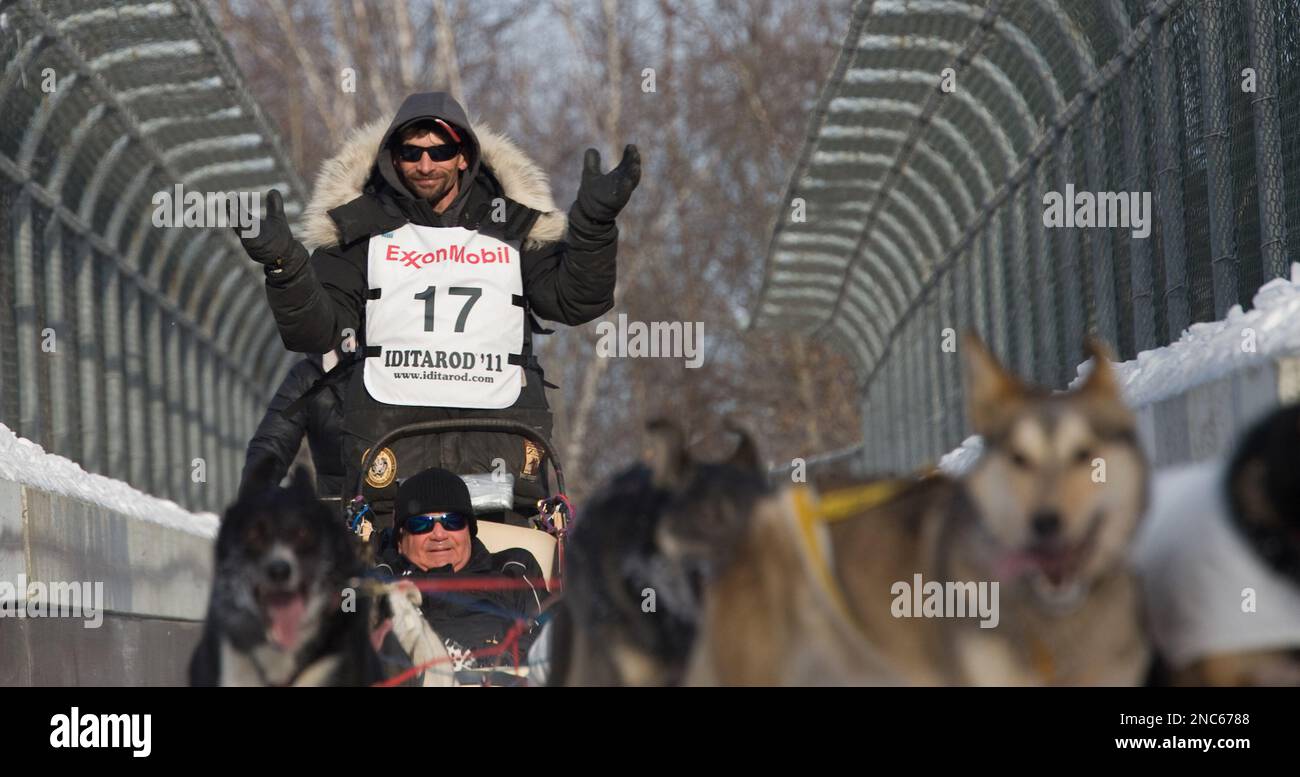 Four-time defending Iditarod champion Lance Mackey encourages his dogs ...