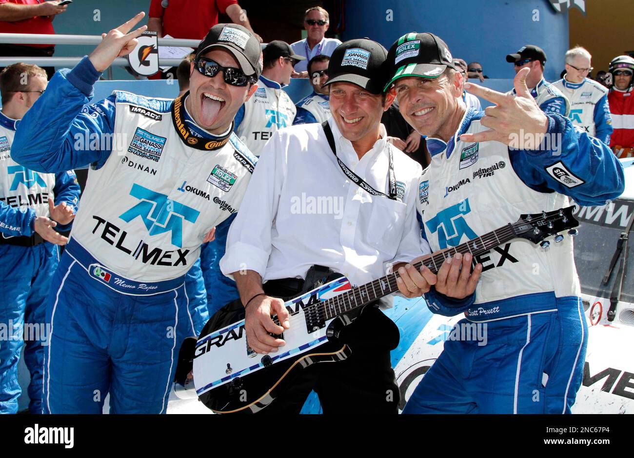 Rolex Series driver Memo Rojas, left, of Mexico, team manager Tim Keene ...