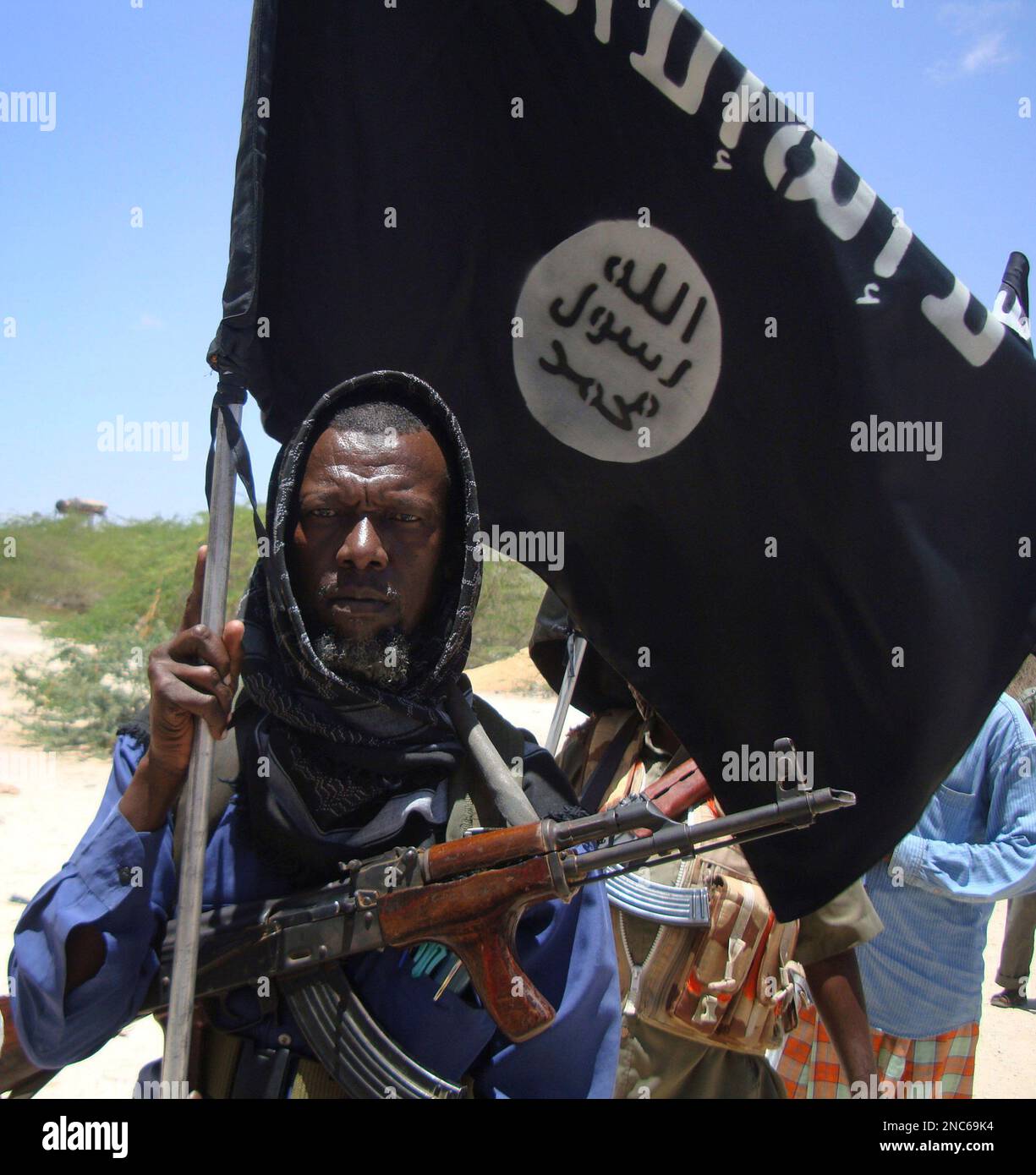 An elderly man from a Somali tribal clan carries an AK-47 and the ...