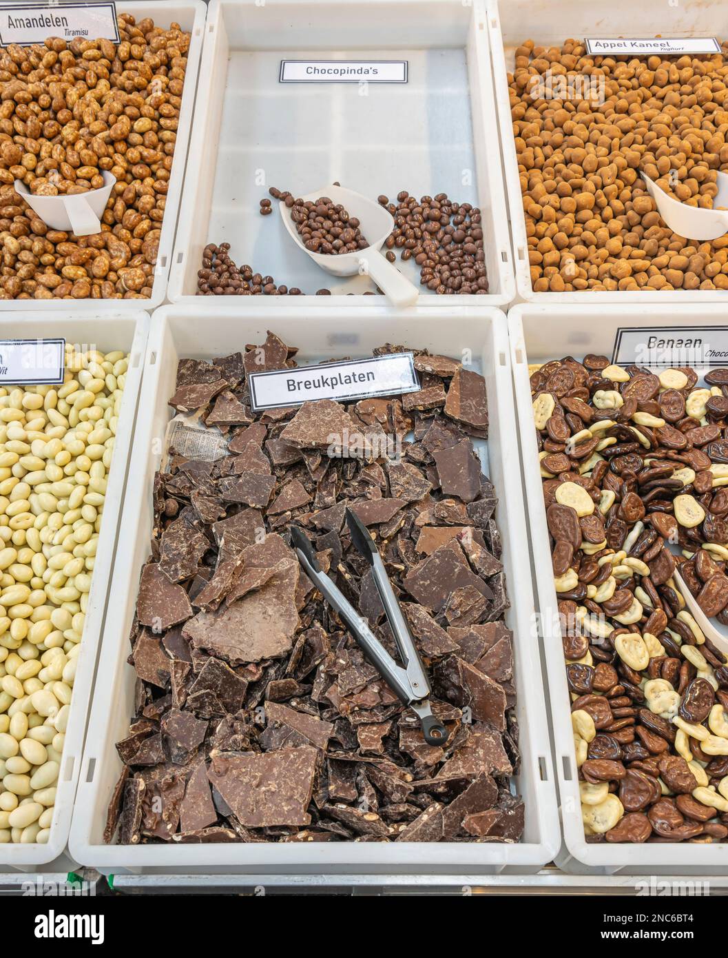 six plastic boxes filled with various sweets Stock Photo - Alamy