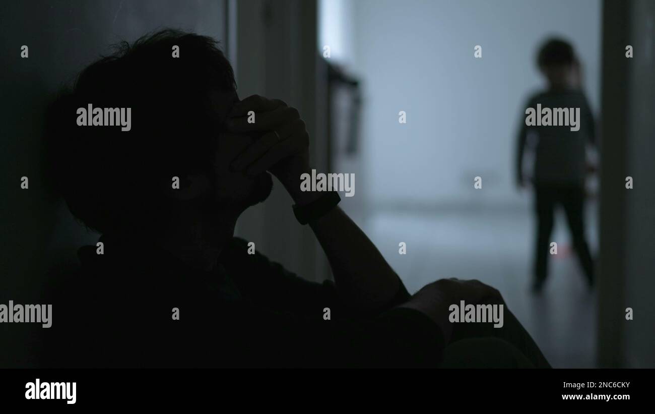 Son hugging father during crisis. Child consoling dad in difficult ...