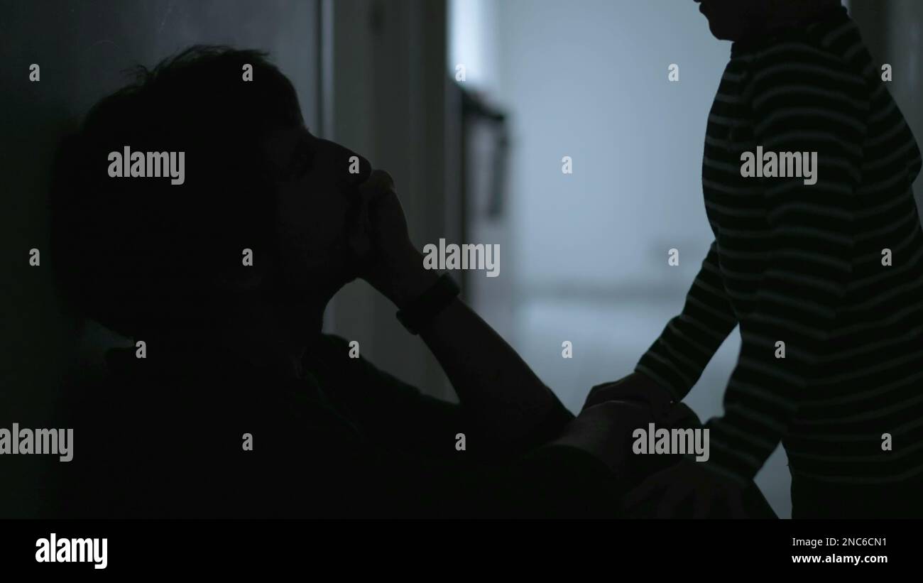 Son hugging father during crisis. Child consoling dad in difficult ...