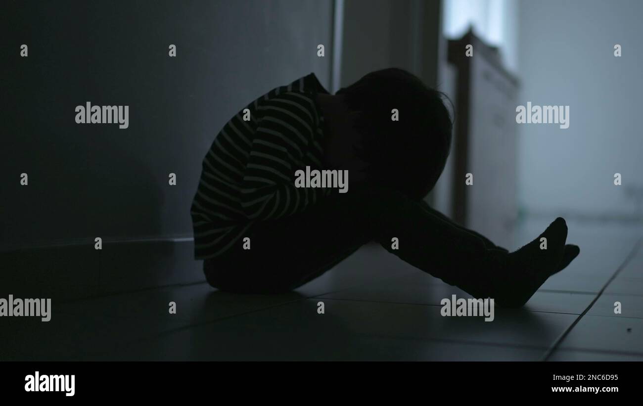 Sad child suffering from childhood depression at home. Psychological ...