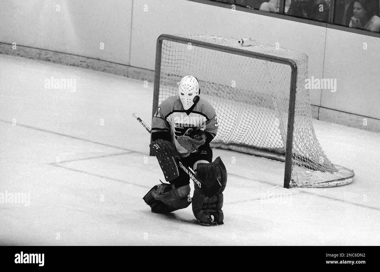 Philadelphia Flyers goalie Pelle Lindbergh keeps his eye on the puck as ...
